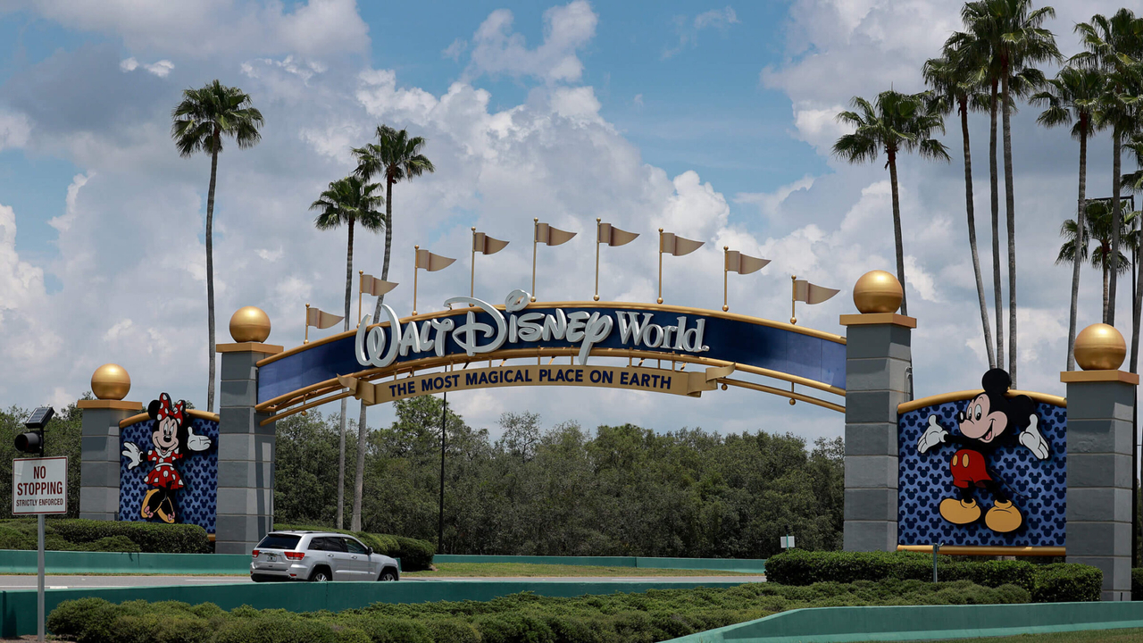 Why are protesters waving swastika flags in front of Disney World?